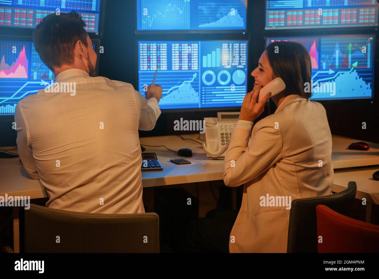 Stock traders working in office Stock Photo - Alamy