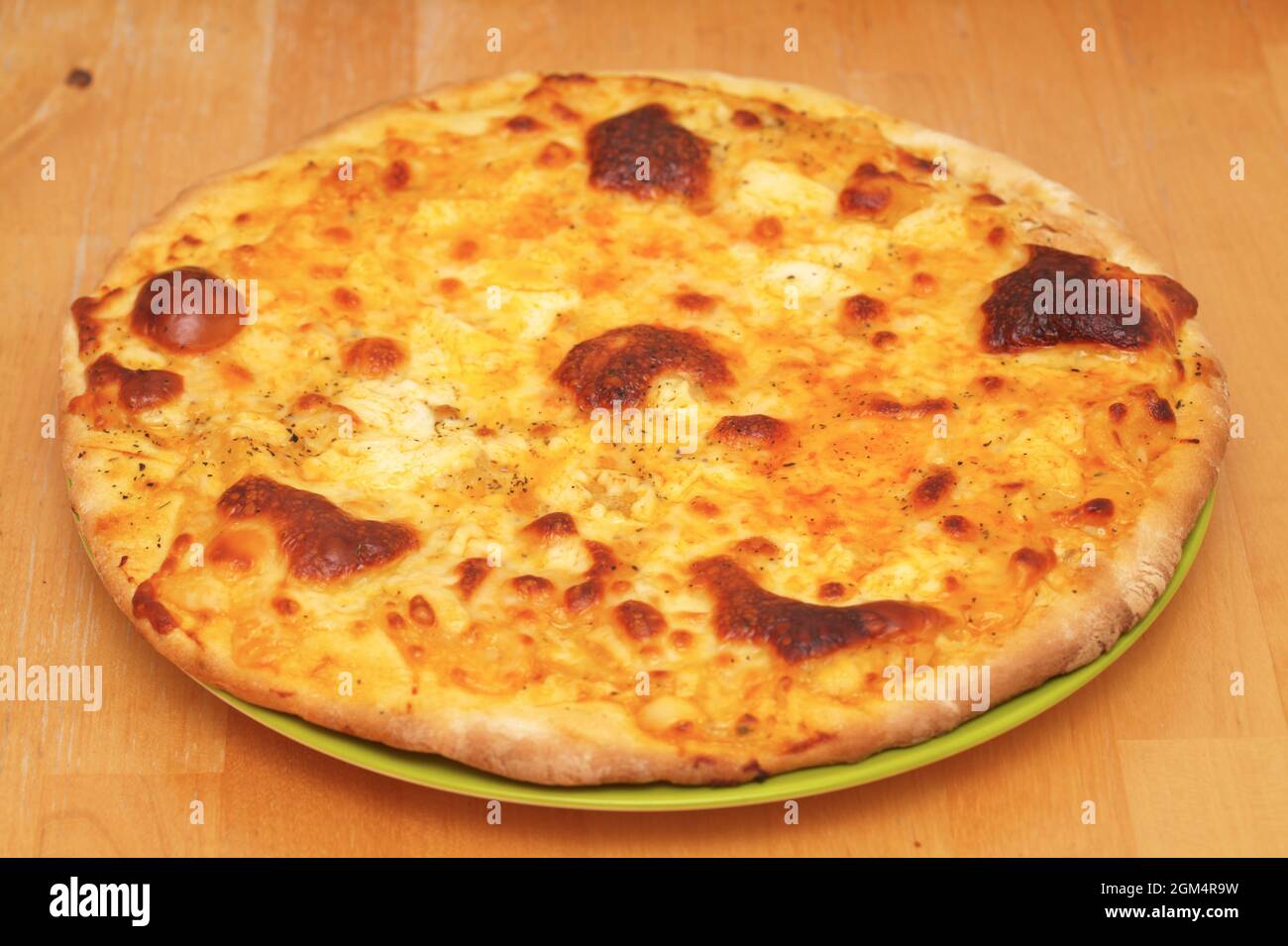 four cheeses pizza, or Pizza quattro formaggi, baked with cheeses ...