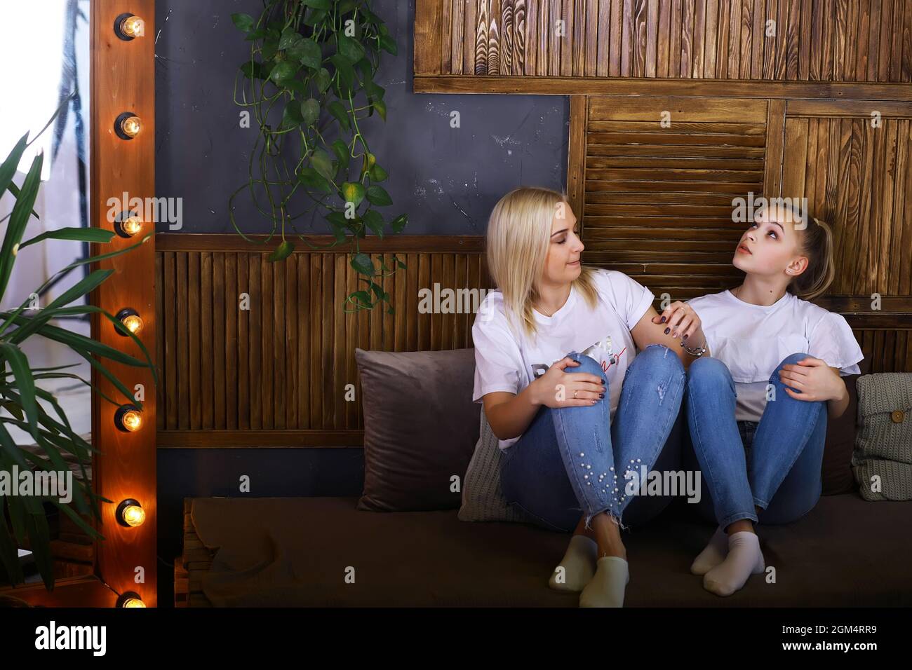 Funny active family of young adult parents and cute small children ...