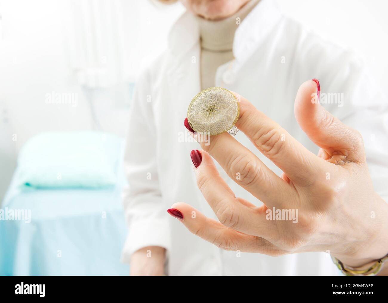 Device for atrial septal defect closure in a hand of a female doctor on ...
