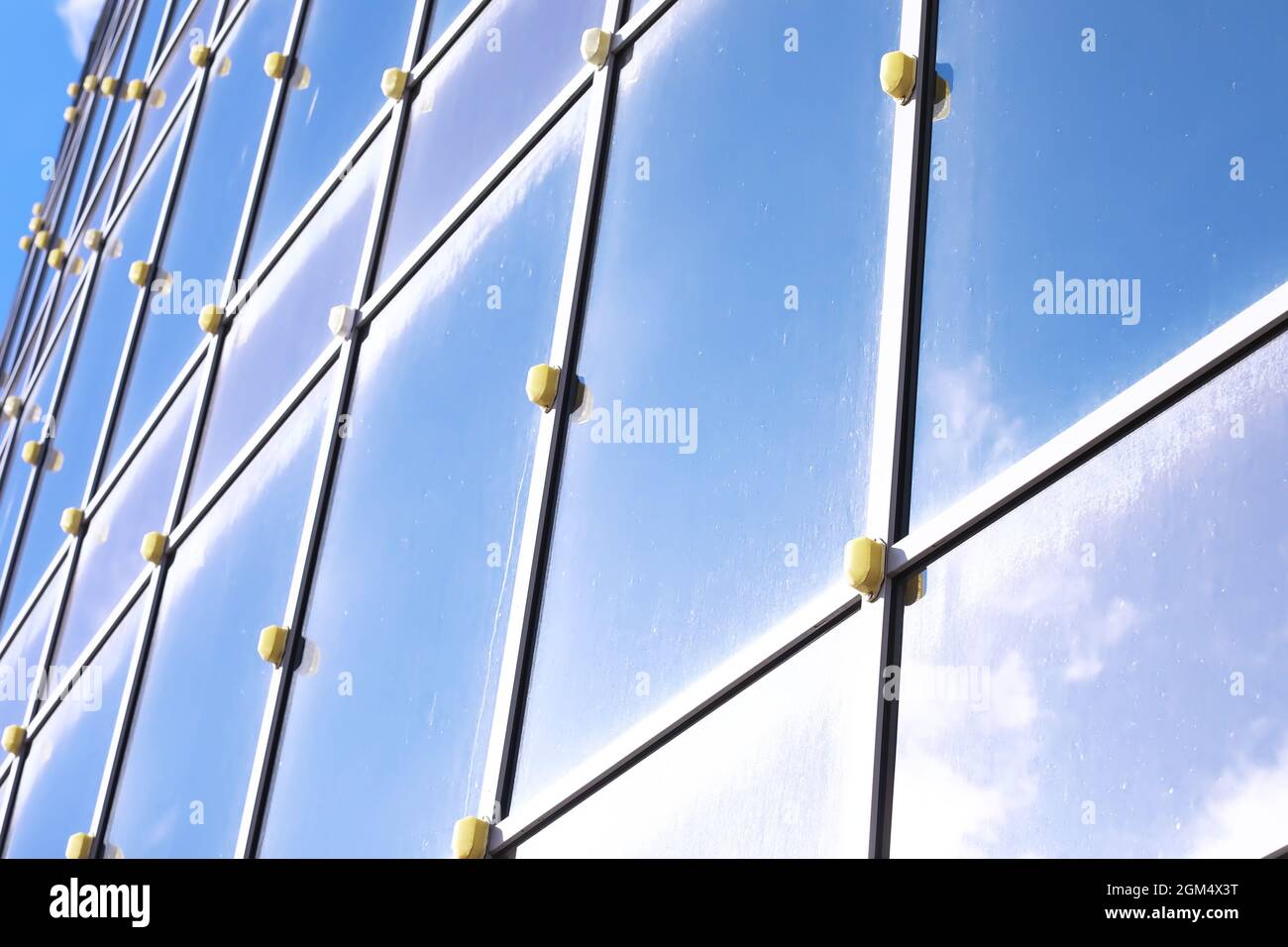 Architectural detail of the facade with multiple reflections of other ...