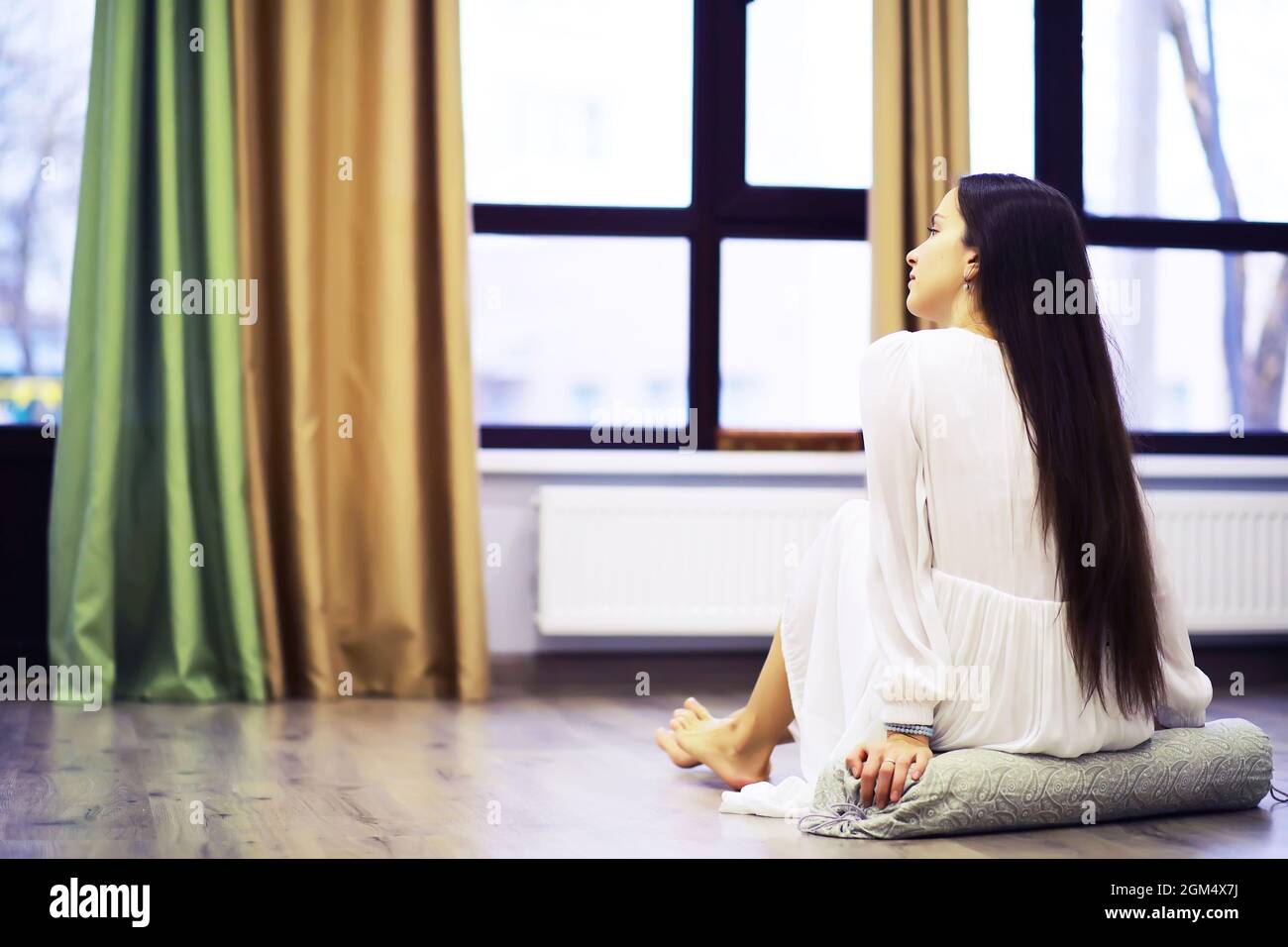 Relaxed serene pretty young woman at home, happy calm lady dream enjoy ...