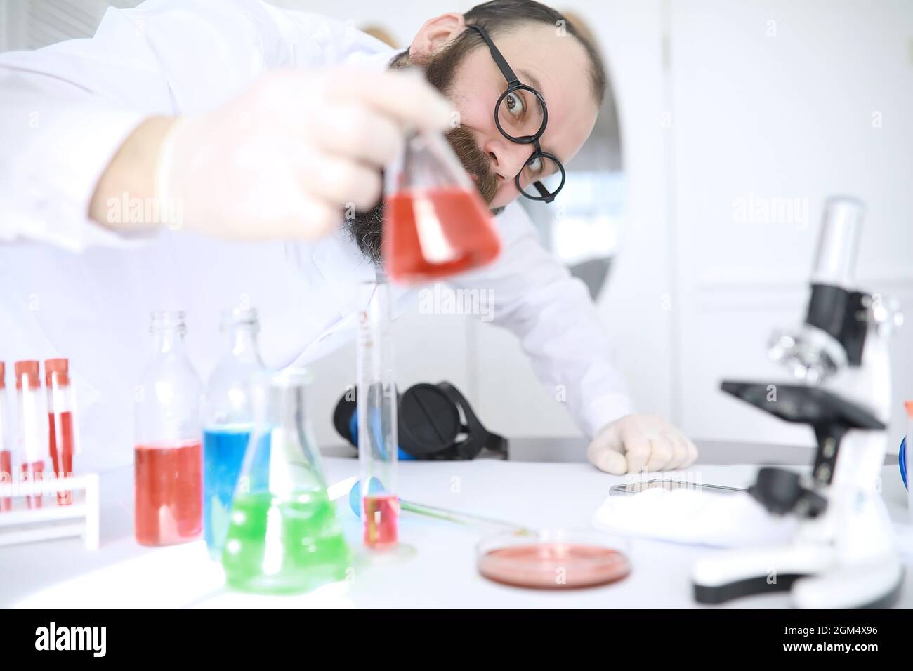 Chemist crazy. A mad scientist conducts experiments in scientific ...