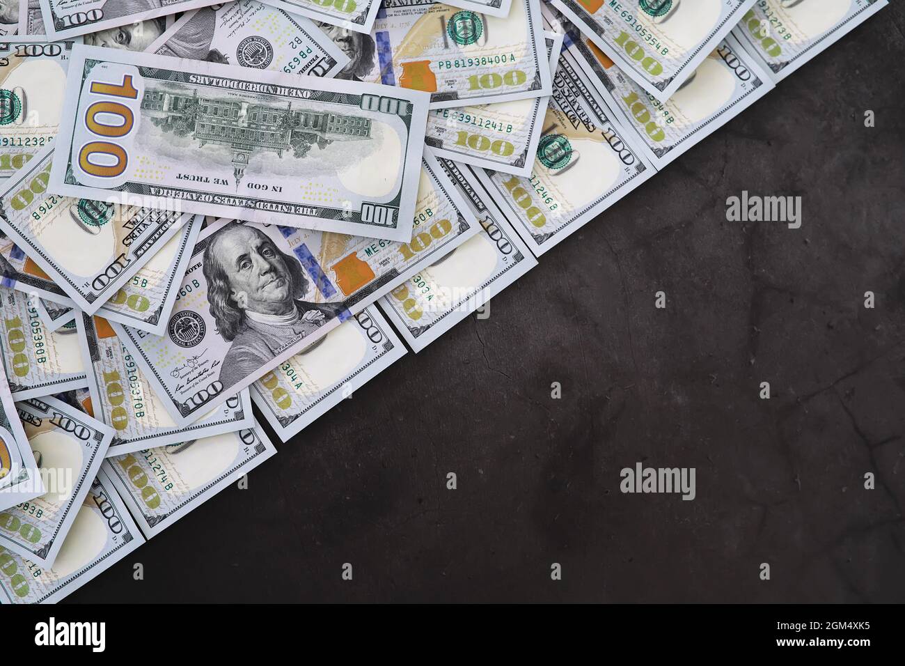 Cash money in a large pile as a finance background. Paper money close ...