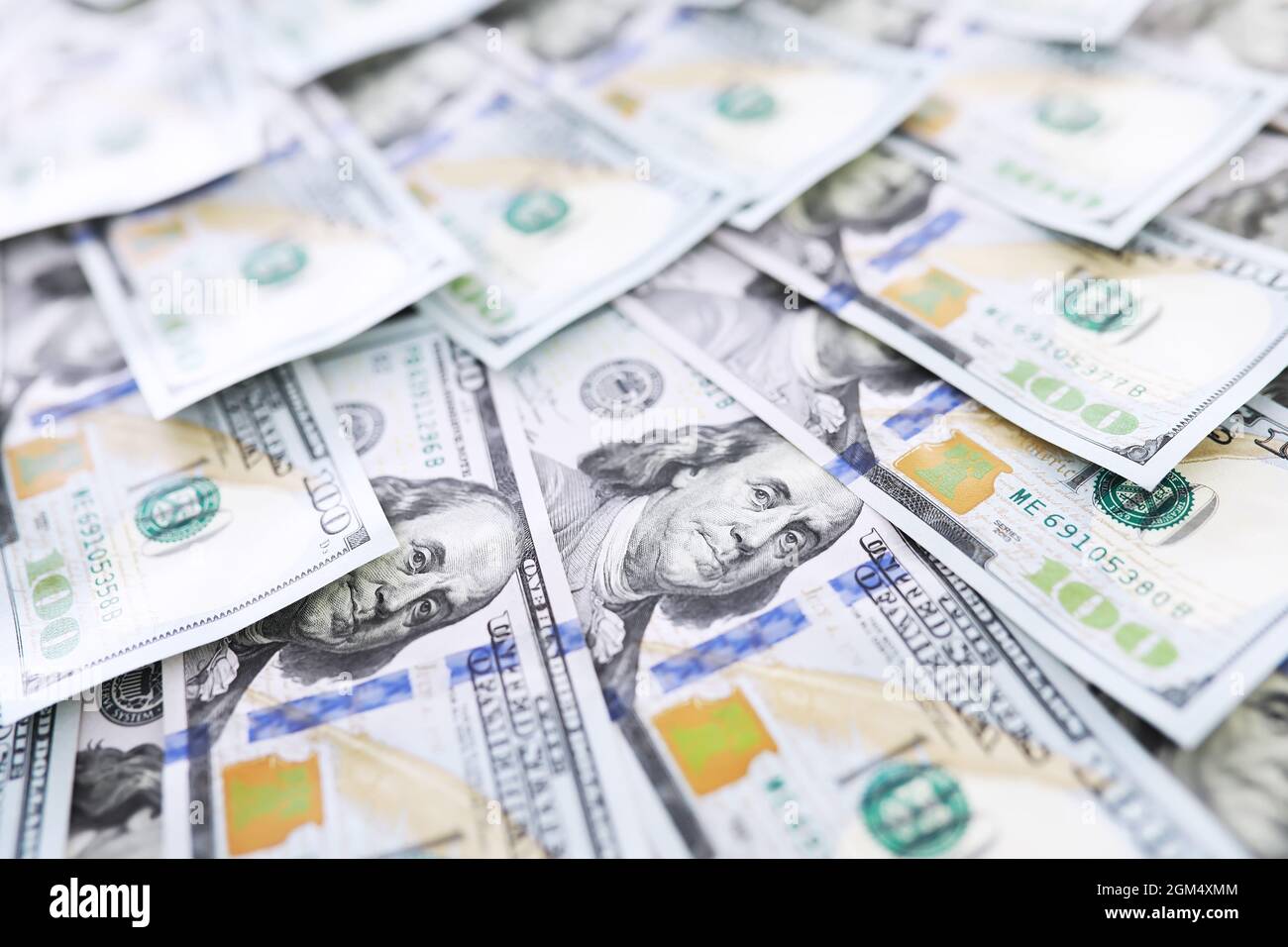 Cash money in a large pile as a finance background. Paper money close ...