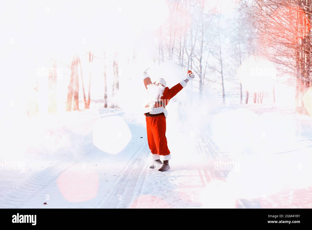 Santa in the winter field. Santa magical fog walking along the field ...