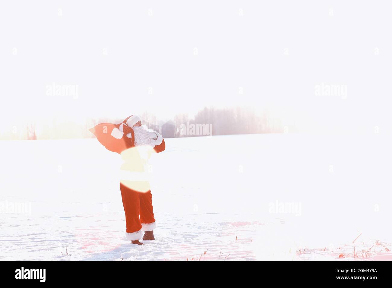Santa in the winter field. Santa magical fog walking along the field ...
