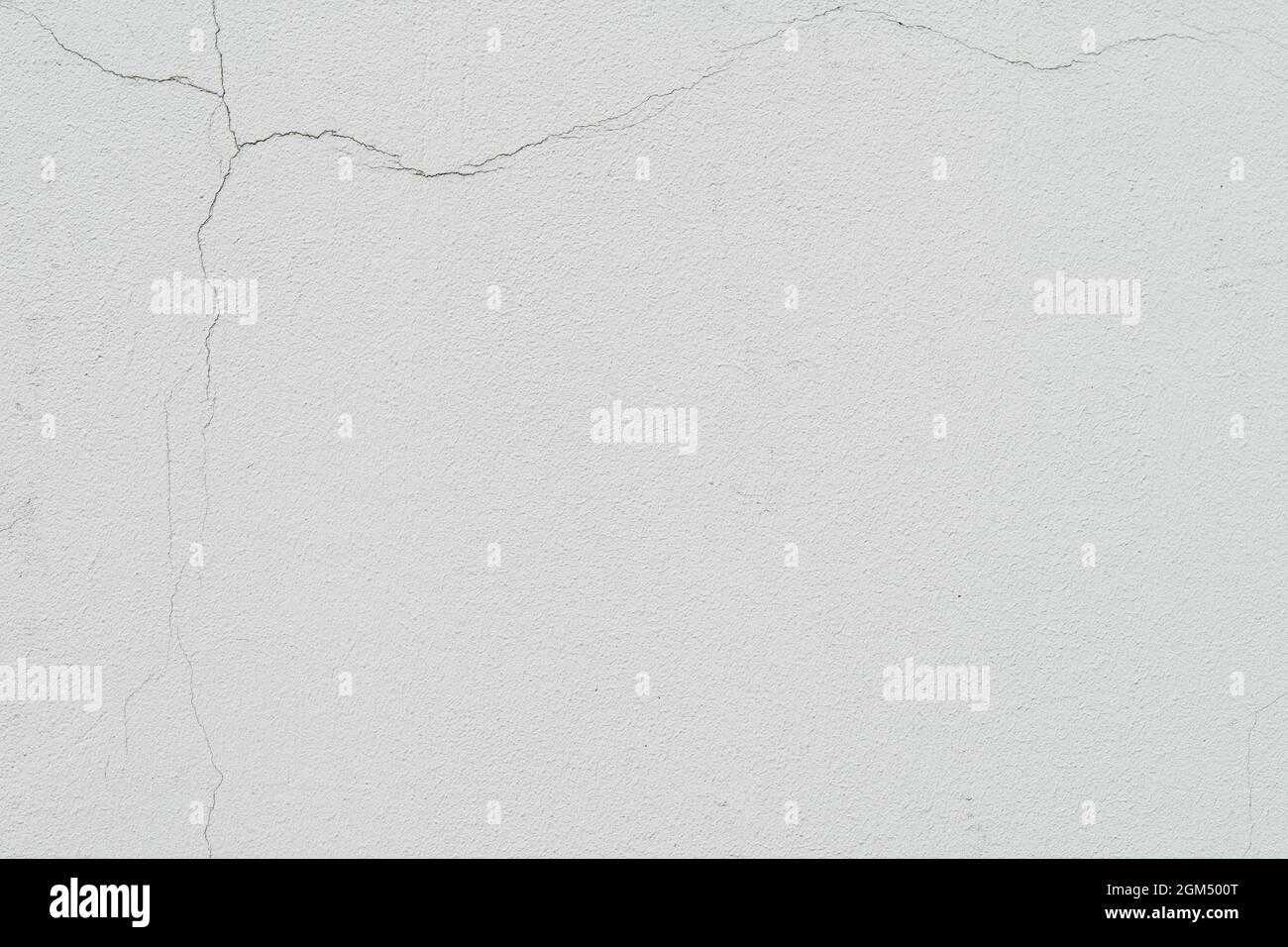 Concrete wall with cracks, texture of ruined plaster, light gray color ...