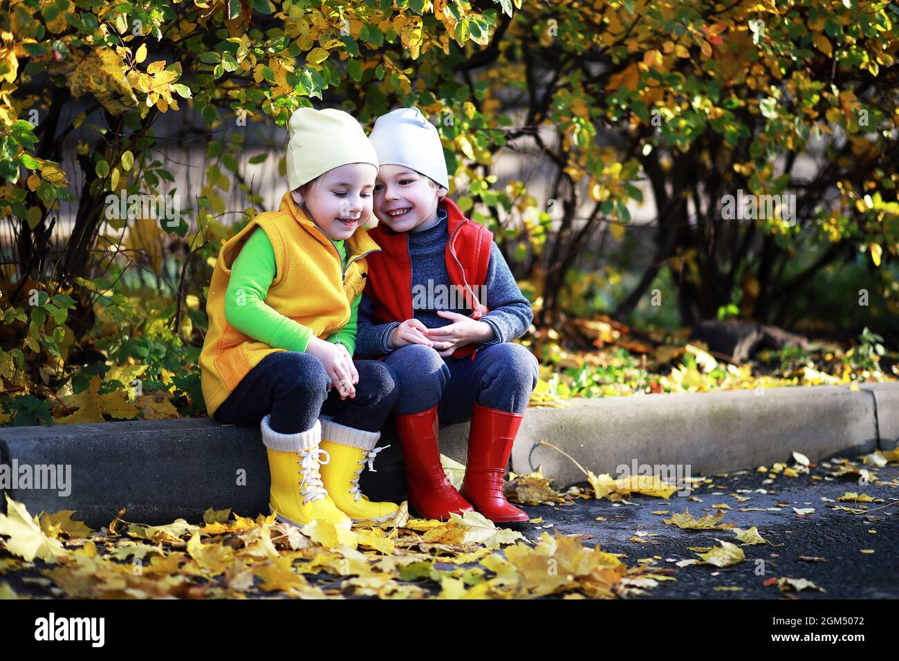 Children walk in the autumn park in the fall Stock Photo - Alamy