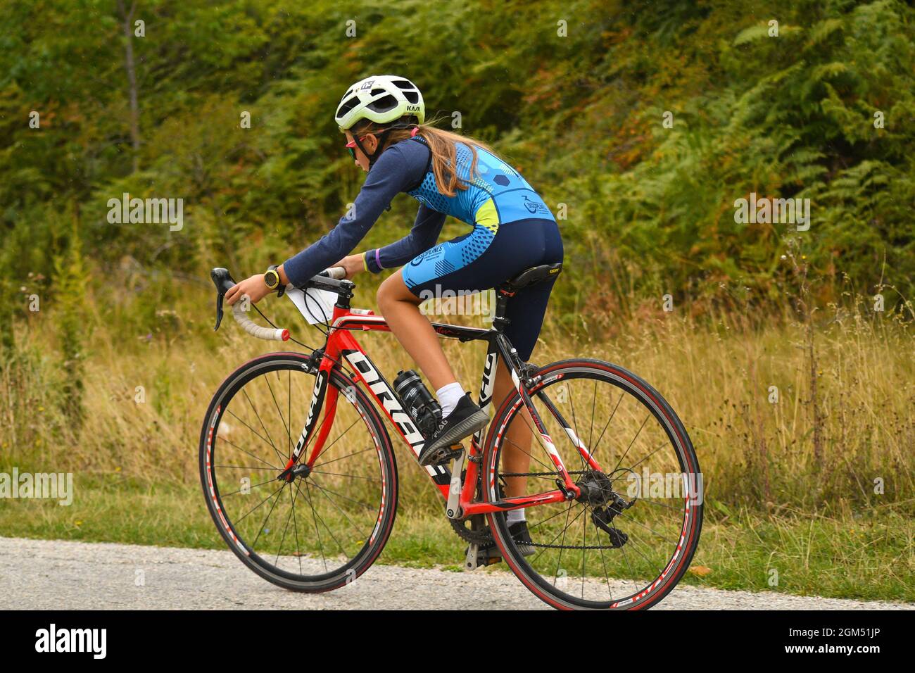 The time trial bicycle race took place in the hilly terrain Stock Photo ...