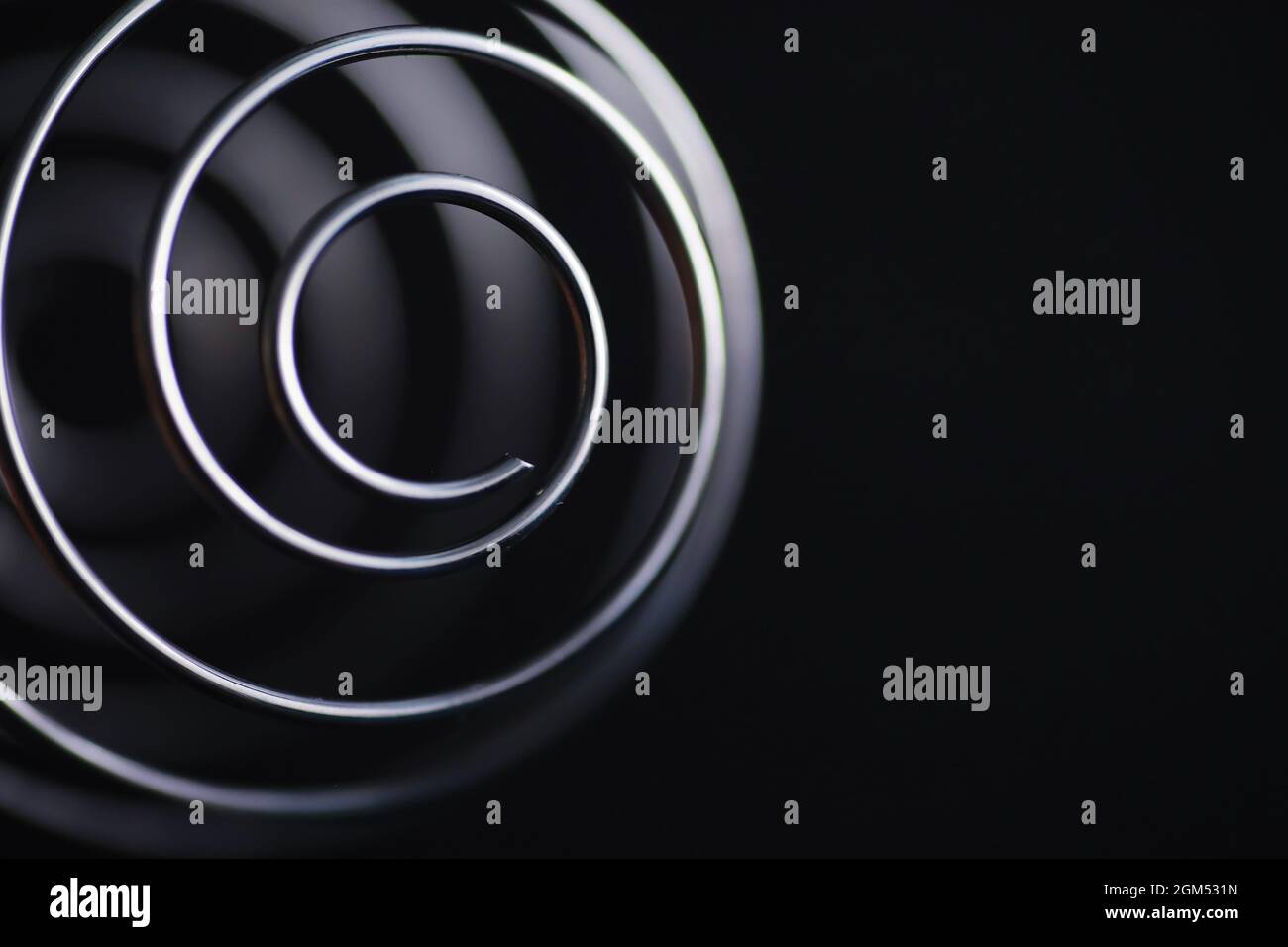 Metal spiral. The concept endless turns. Golden ratio. The concept of ...