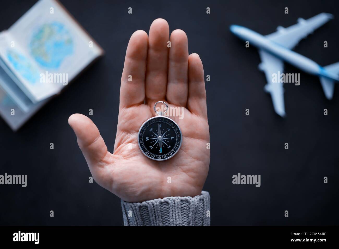 Travel concept. Magnetic compass in the hand. Retro navigator in hand ...