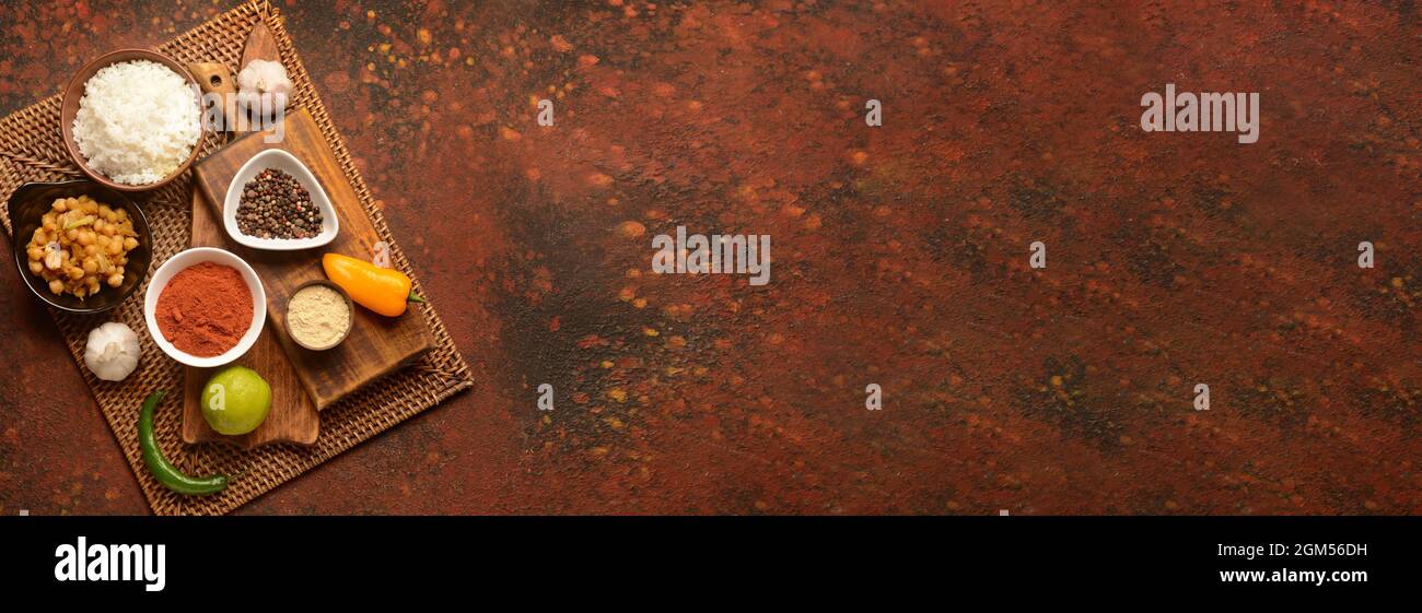 Traditional Indian food and spices on color background with space for ...