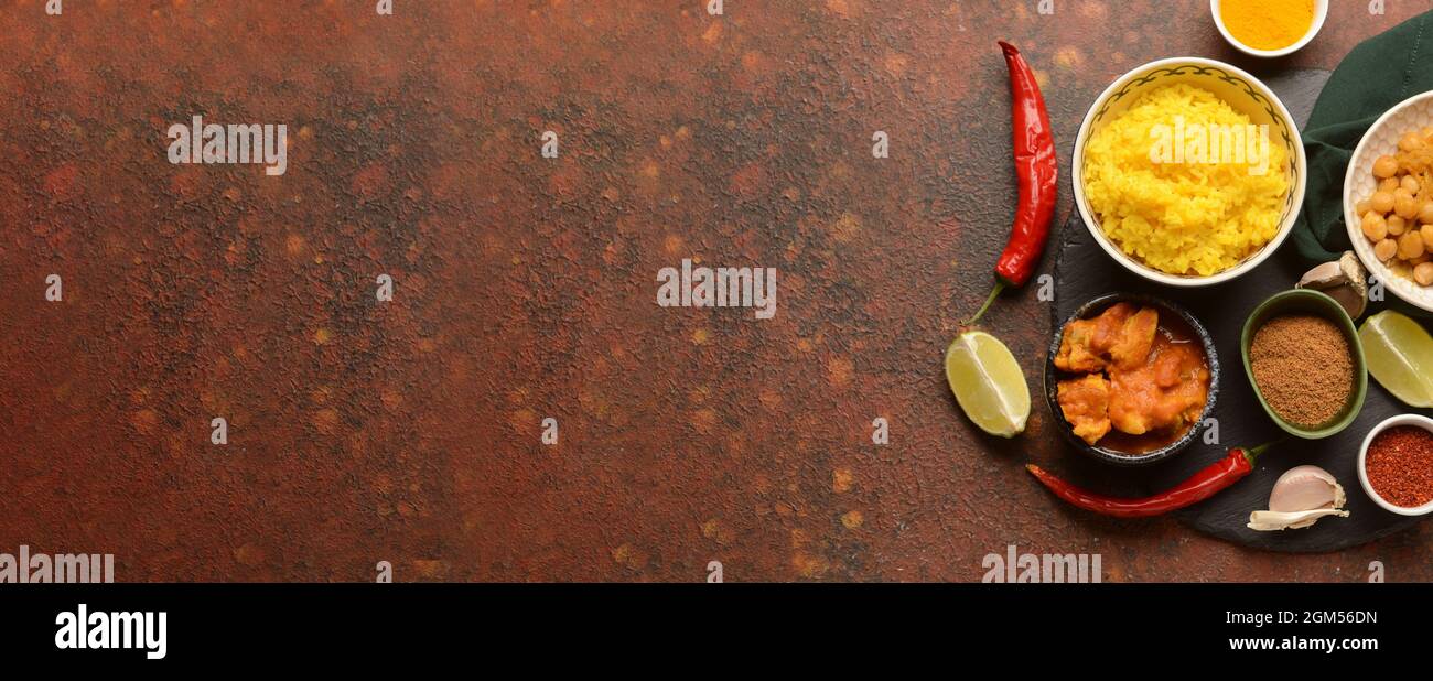 Traditional Indian food and spices on color background with space for ...