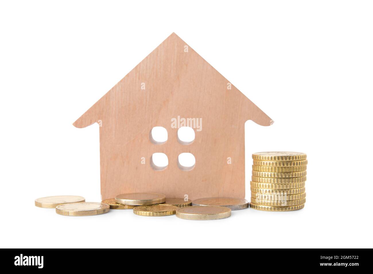 Model of house with coins on white background Stock Photo - Alamy