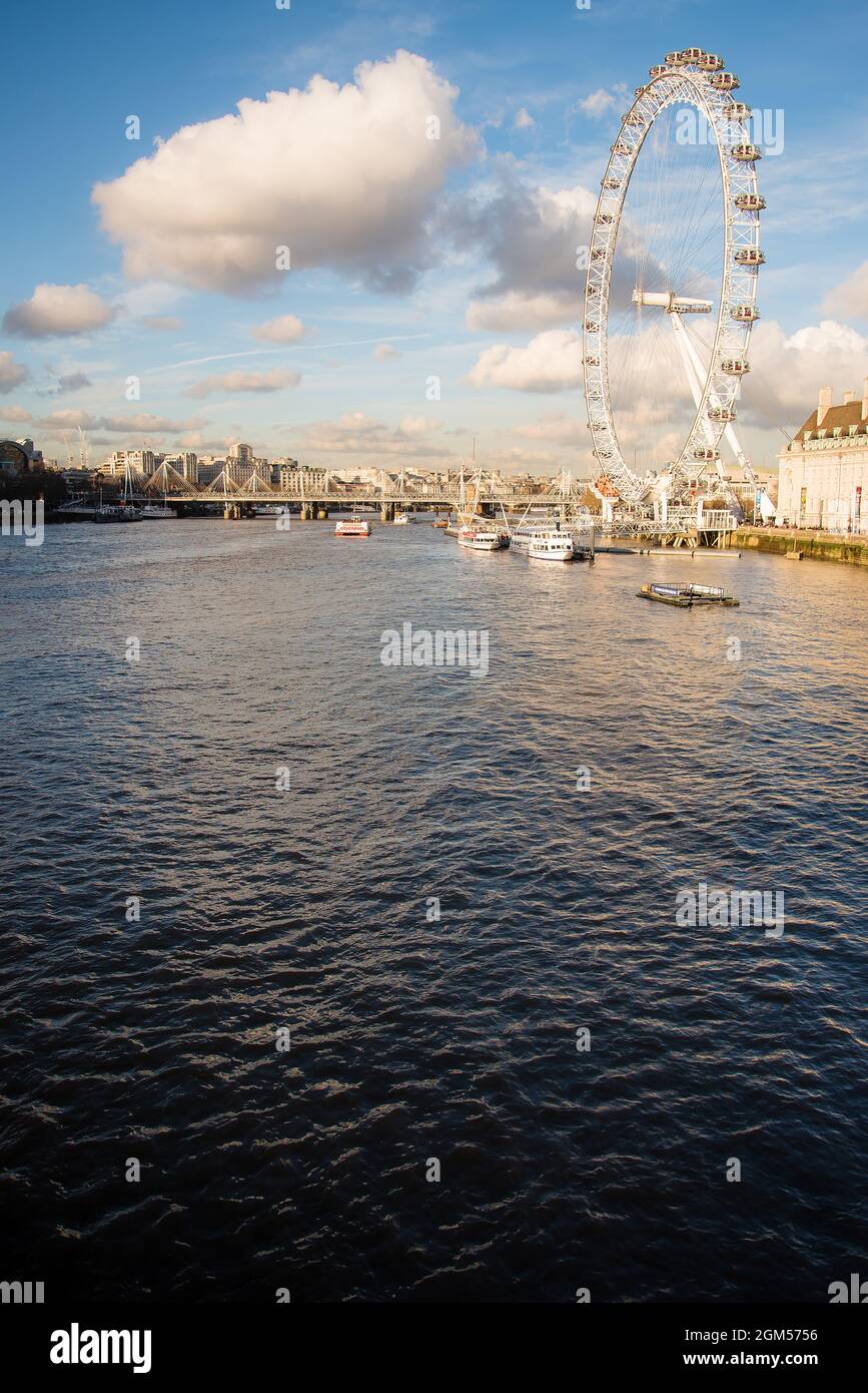 View of the River Thames in the foreground and the London Eye in the ...