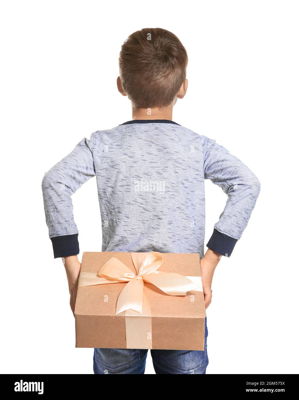 Cute little boy hiding gift for Mother's Day behind his back, on white ...