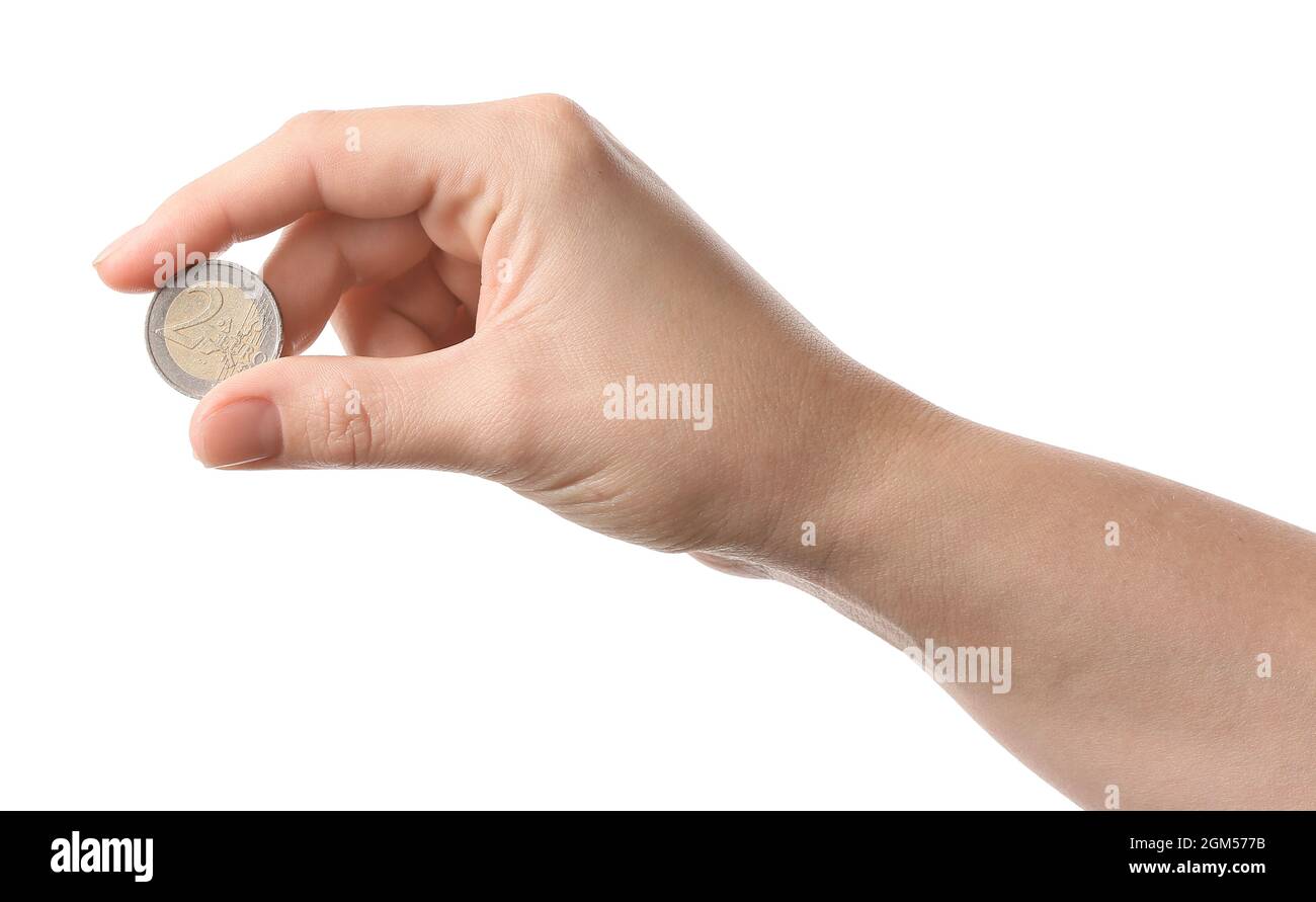 Female hand with coin on white background Stock Photo - Alamy