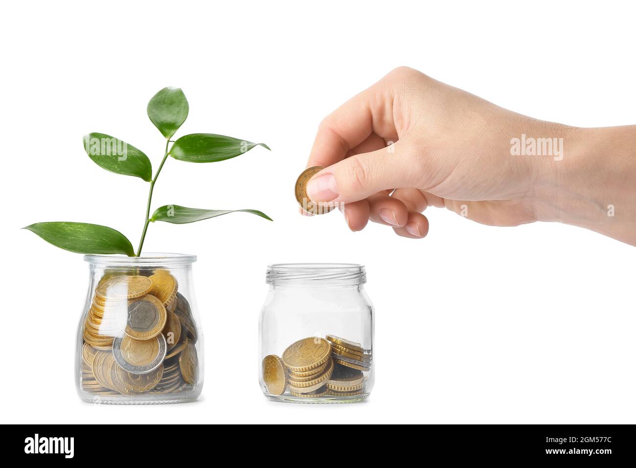 Female hand putting coin into jar against white background Stock Photo ...