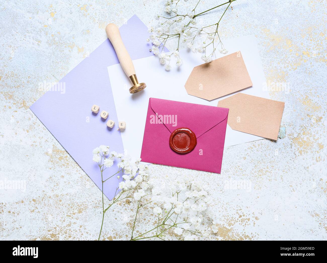 Envelope with cards, stamp and flowers on white background Stock Photo ...