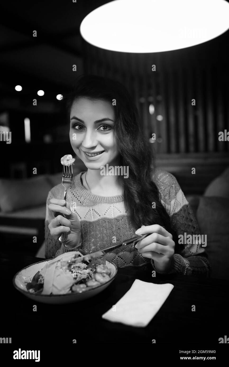 Beautiful girl in a cafe having a cup of coffee at a dinner Stock Photo ...