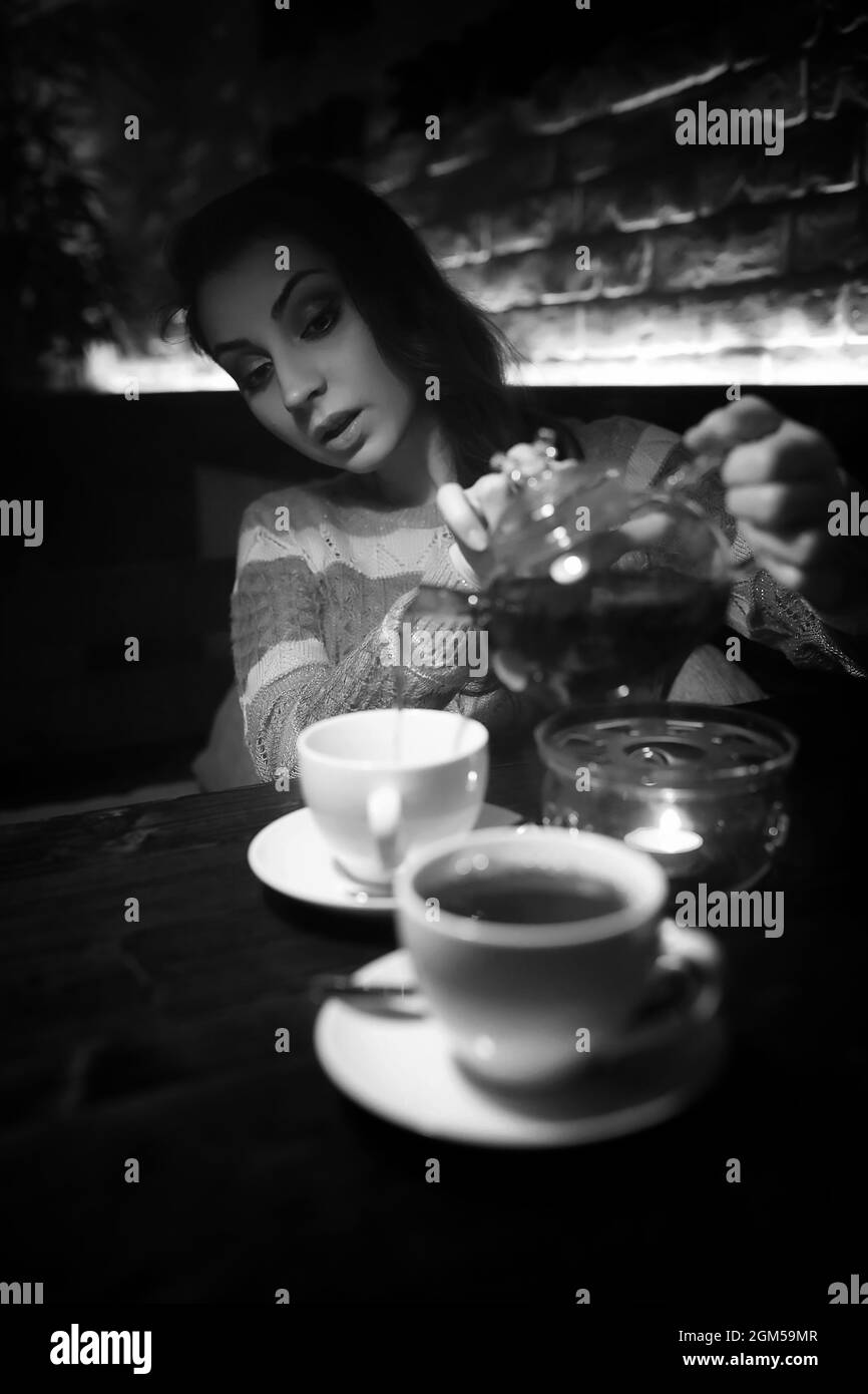Beautiful girl in a cafe having a cup of coffee at a dinner Stock Photo ...