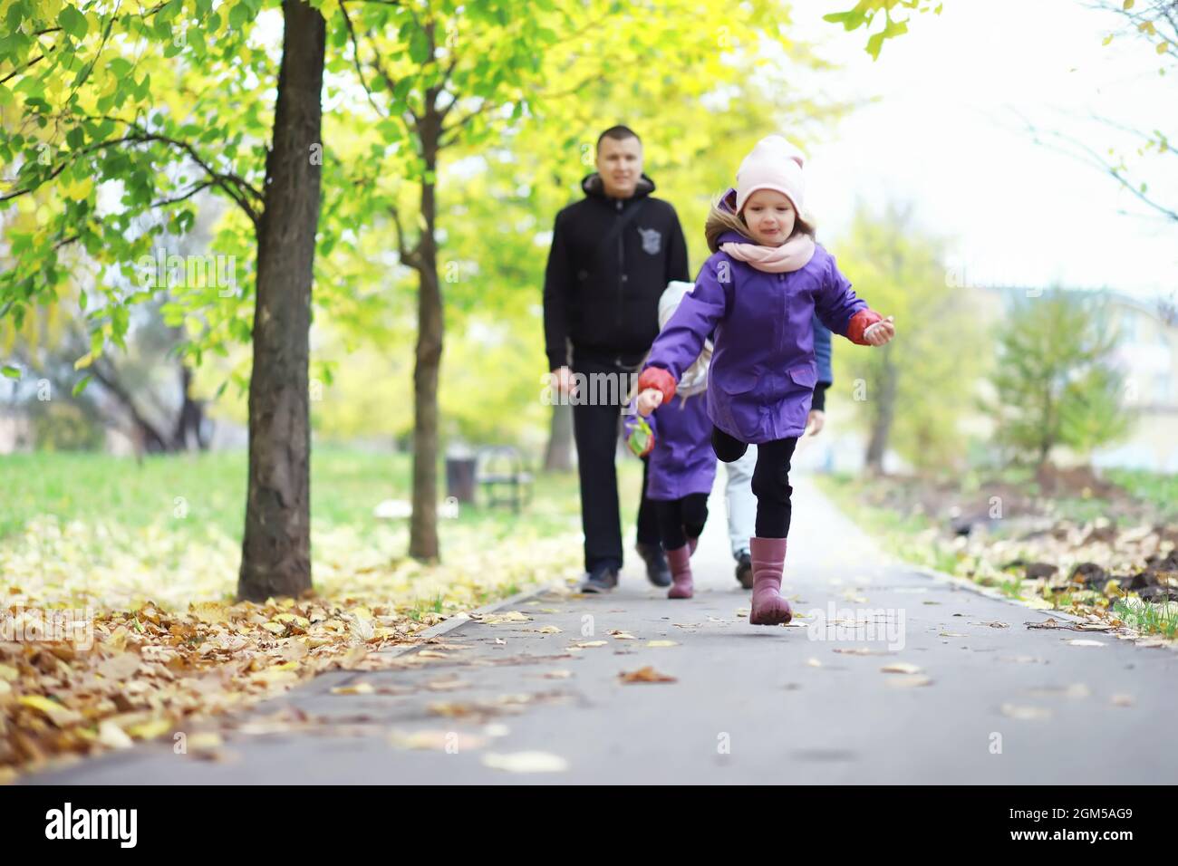 Children for a walk in autumn park. Leaf fall in the park. Family. Fall ...