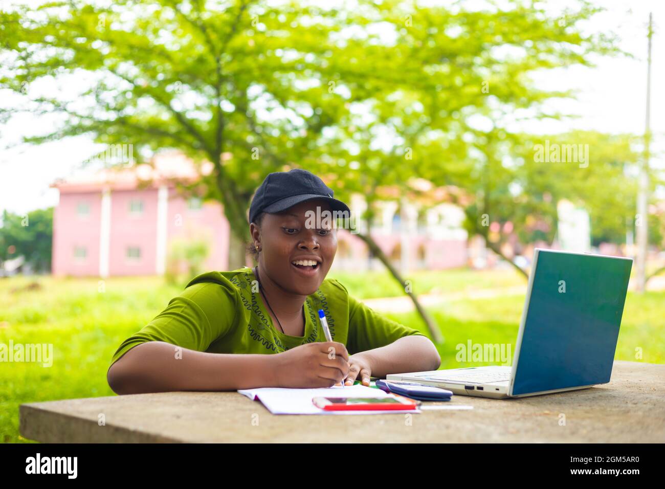 Female student happily studying hi-res stock photography and images - Alamy