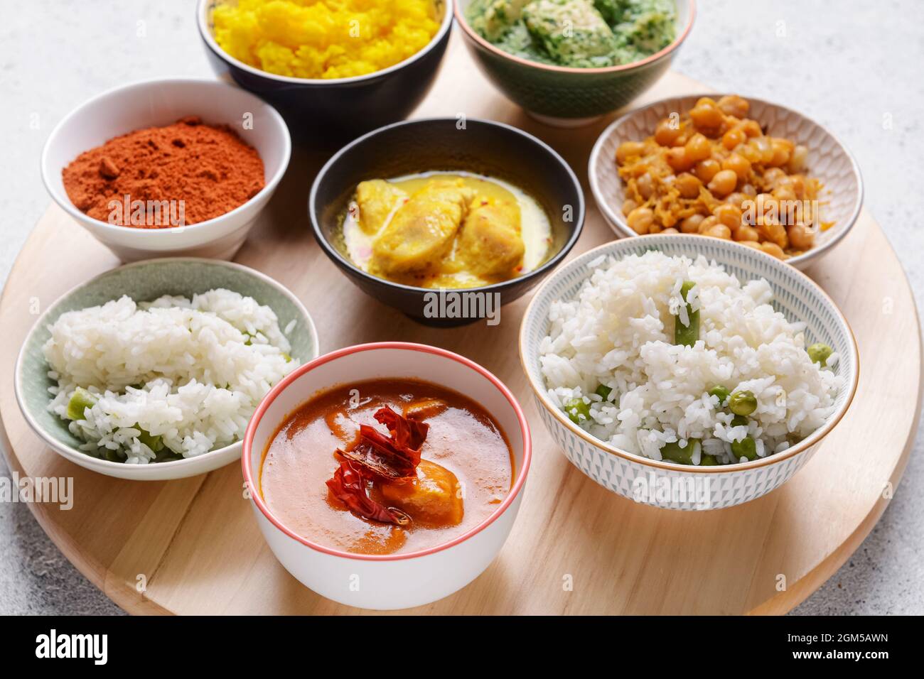 Traditional Indian food and spices on board Stock Photo - Alamy