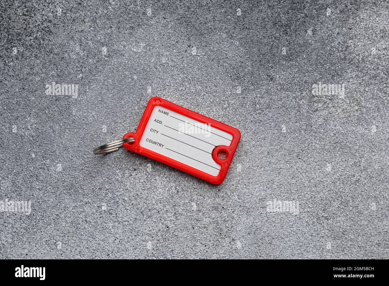 Red plastic key tag hi-res stock photography and images - Alamy