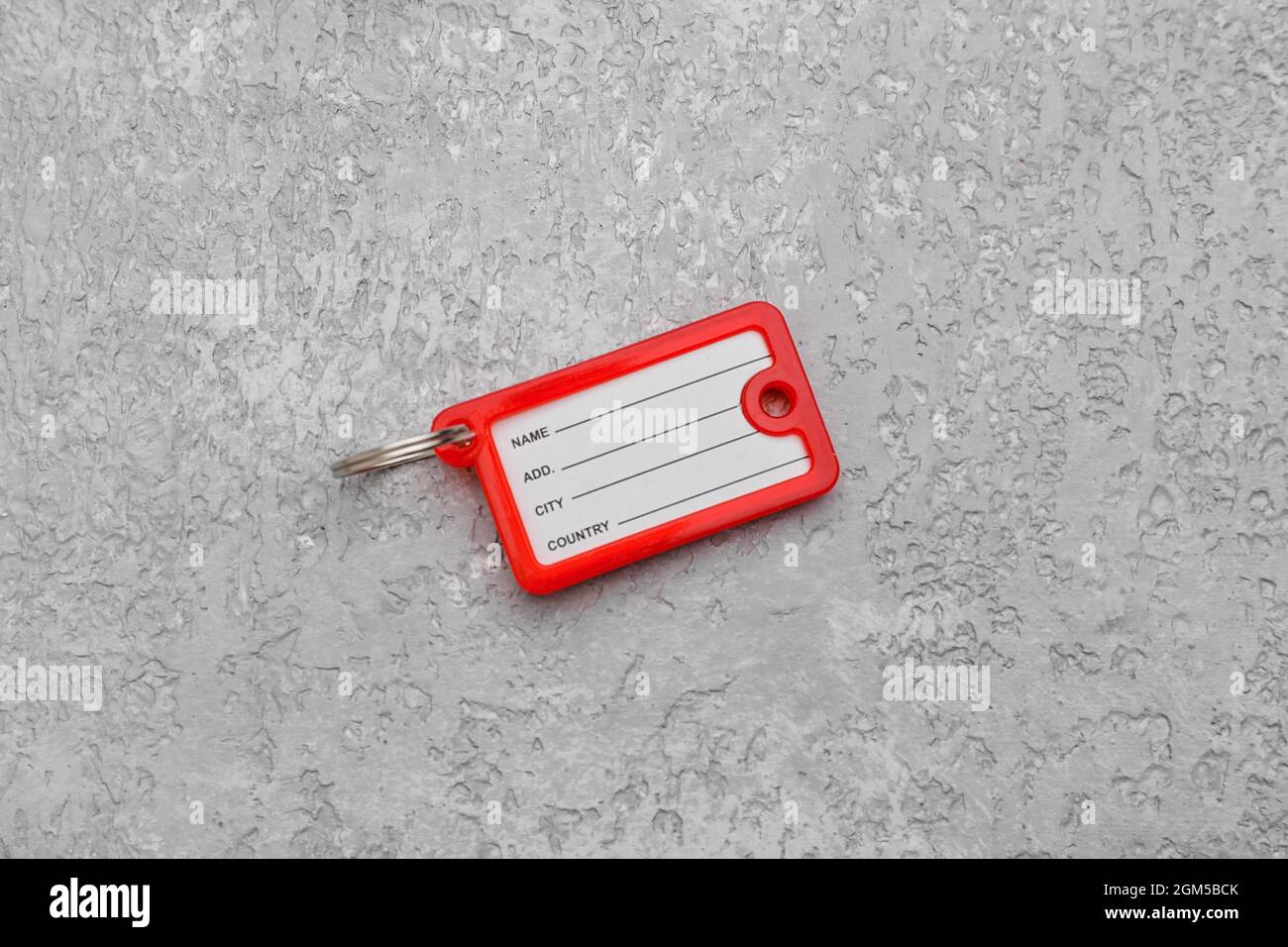 Red plastic key tag hi-res stock photography and images - Alamy