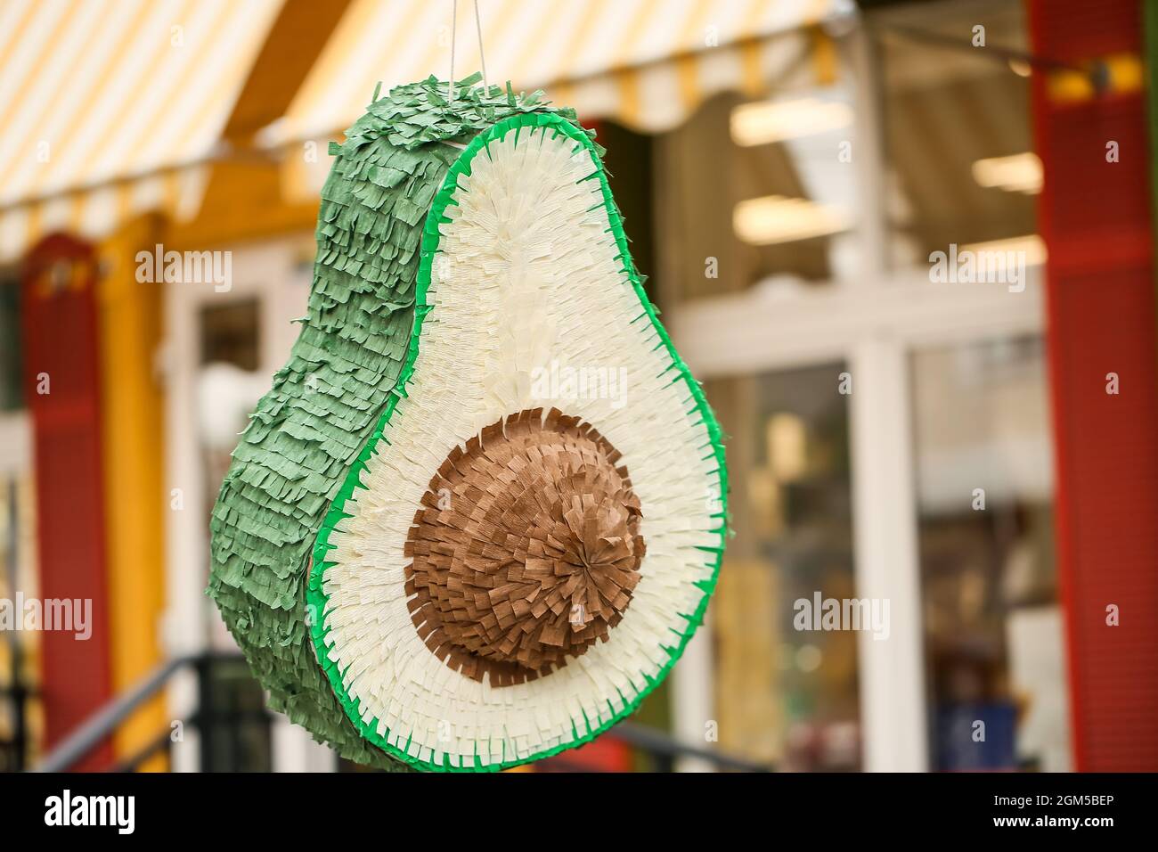 Creative Mexican pinata hanging outdoors Stock Photo - Alamy