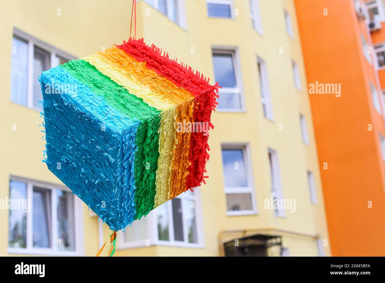 Creative Mexican pinata hanging outdoors Stock Photo - Alamy