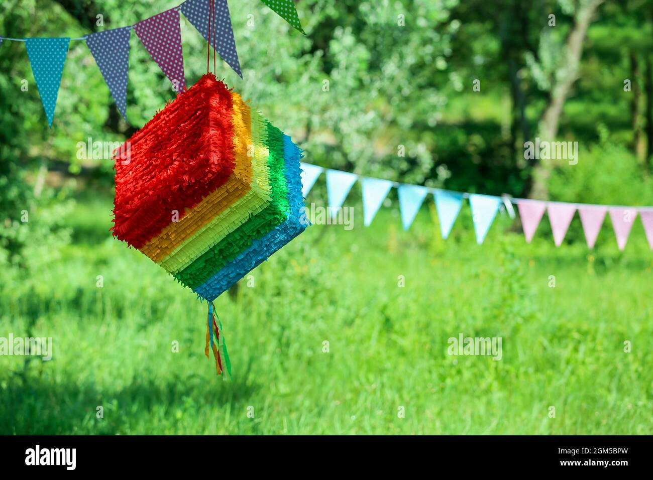 Colorful Mexican pinata hanging outdoors Stock Photo - Alamy
