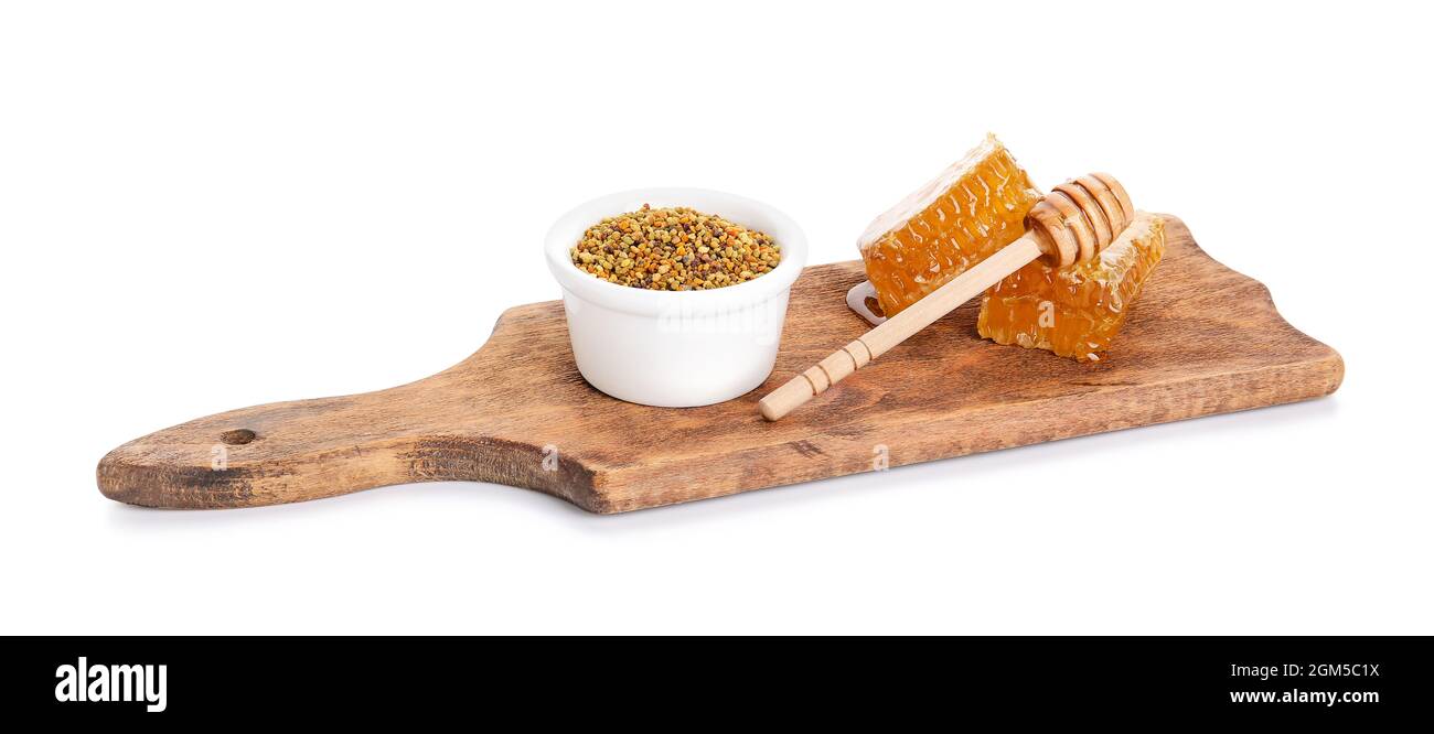 Bowl of bee pollen and honey combs on white background Stock Photo - Alamy