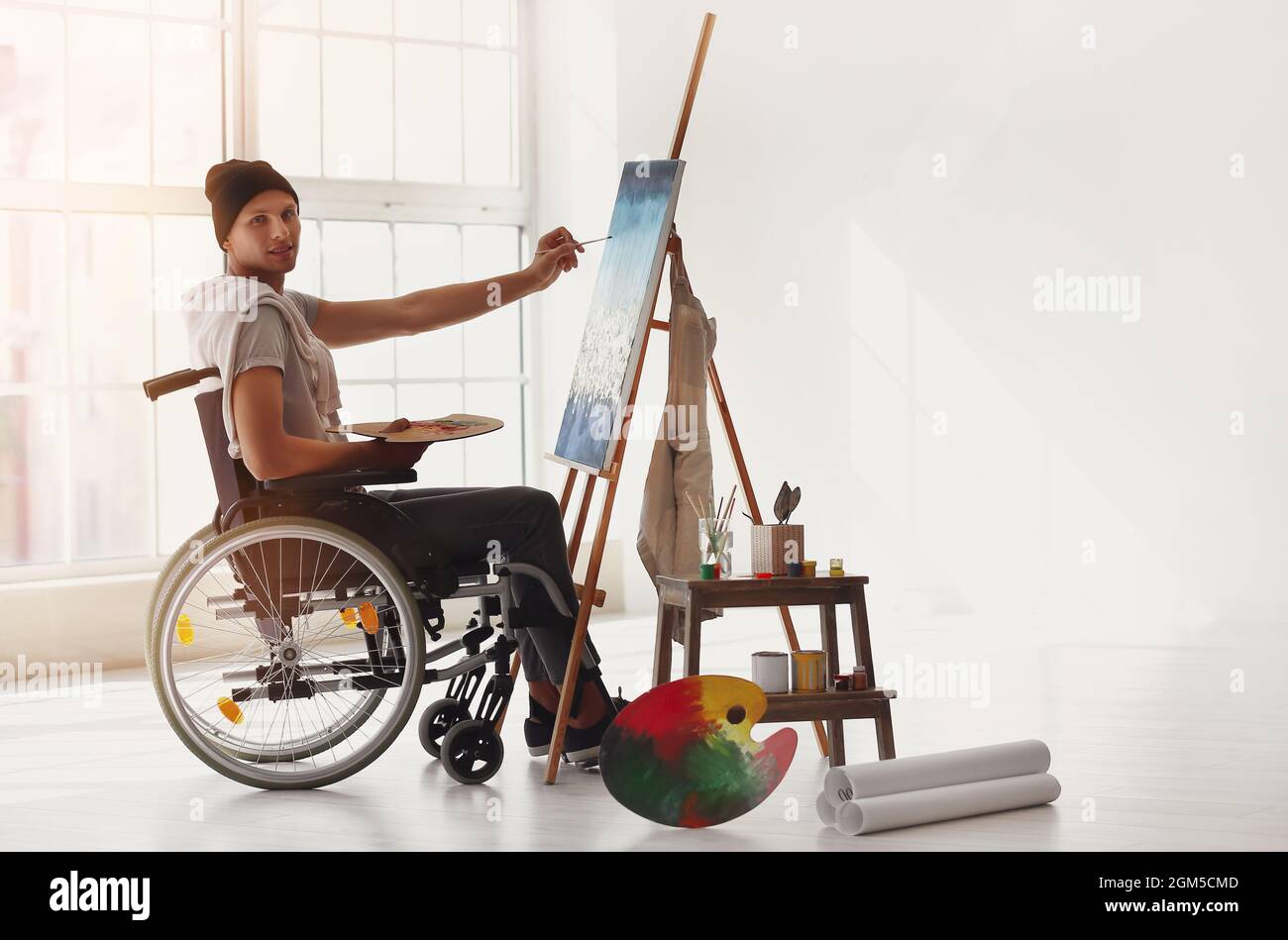 Young handicapped artist drawing hi-res stock photography and images ...