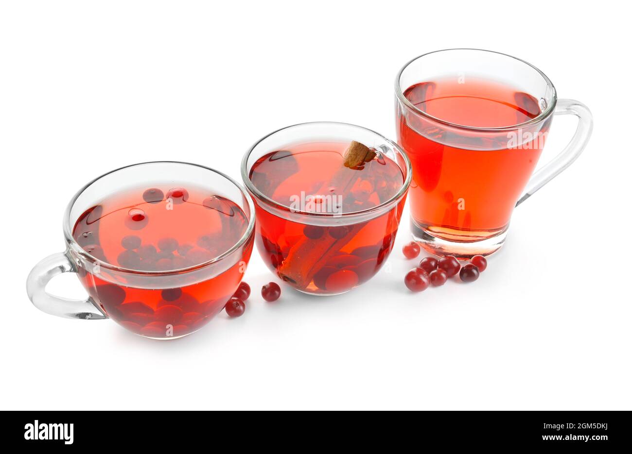 Cups of tasty tea with cranberry on white background Stock Photo - Alamy