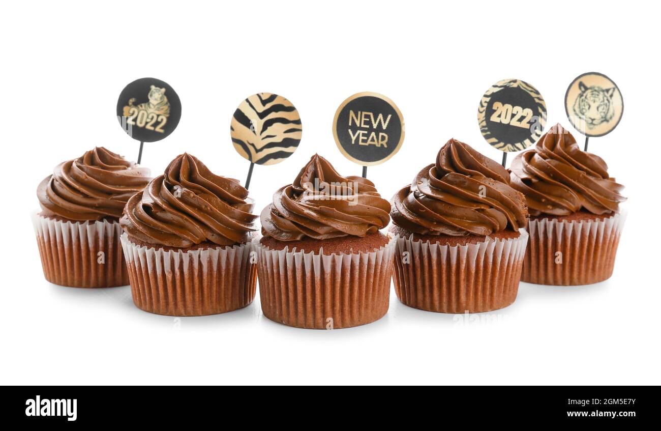 Tasty cupcakes for New Year 2022 celebration on white background Stock ...