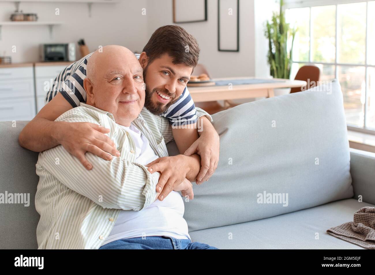 Happy man and his father at home Stock Photo - Alamy