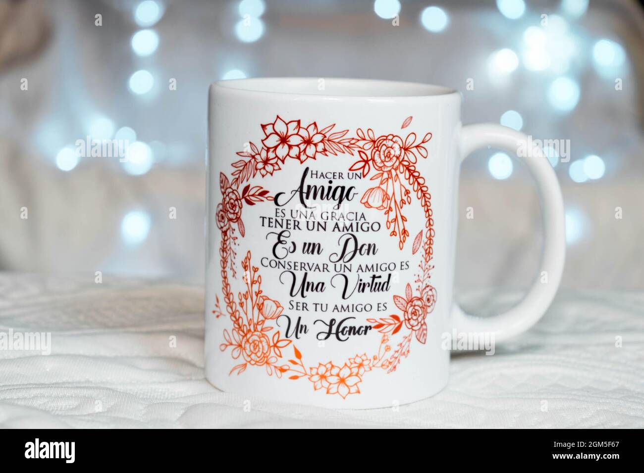 mug with thoughtful phrase, on the bed, mug on white cloth, blue ...