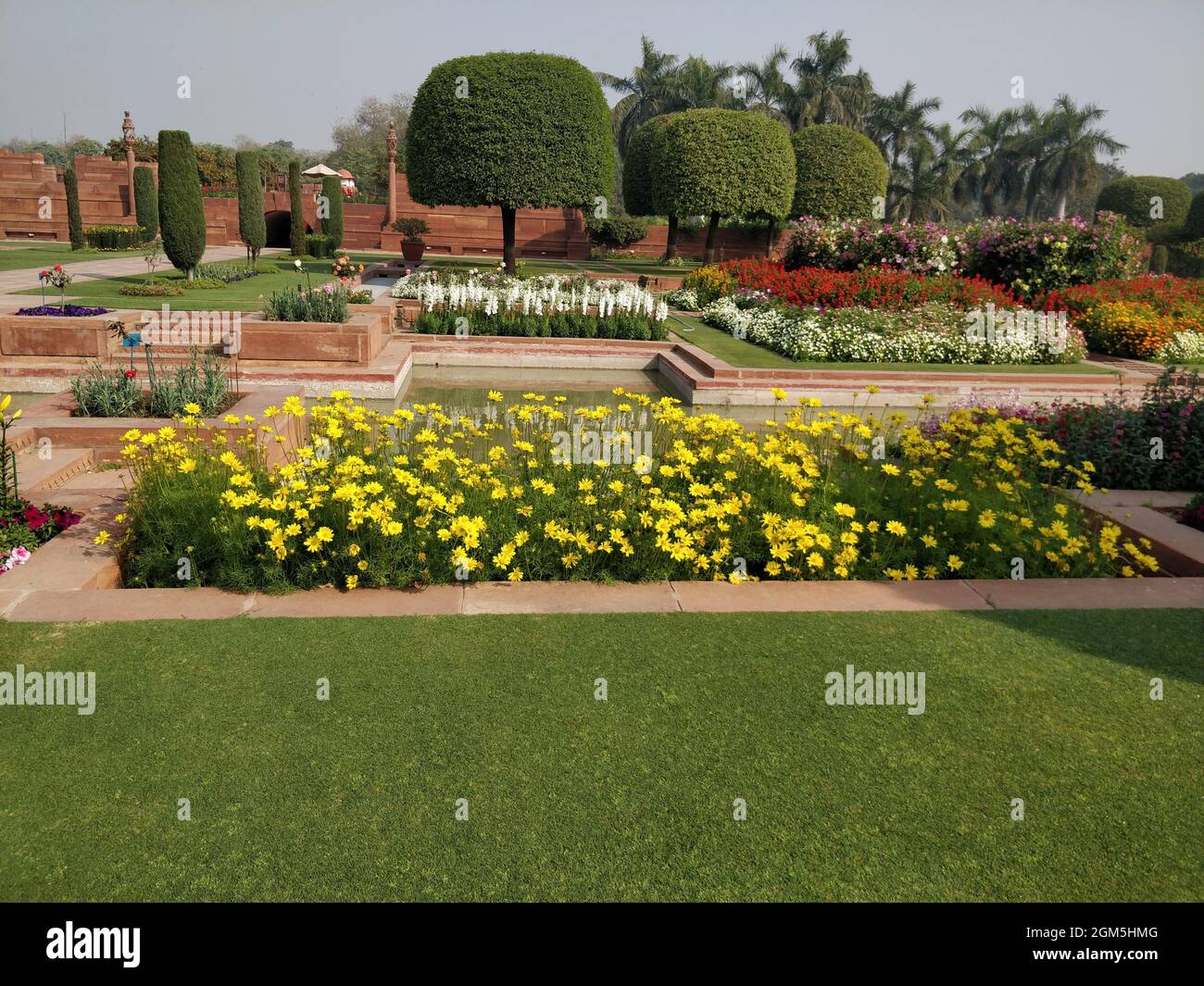 Landscape of greenery and flowers in Mughal Gardens in Delhi, India ...