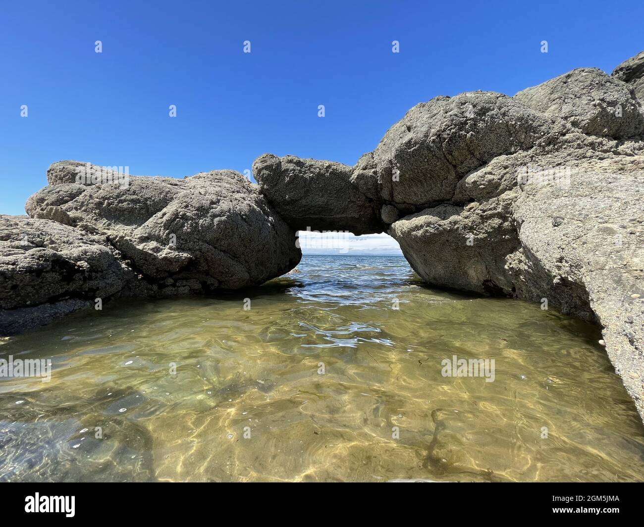 Scenic shot of a geological stone hill formation looking like a tunnel ...