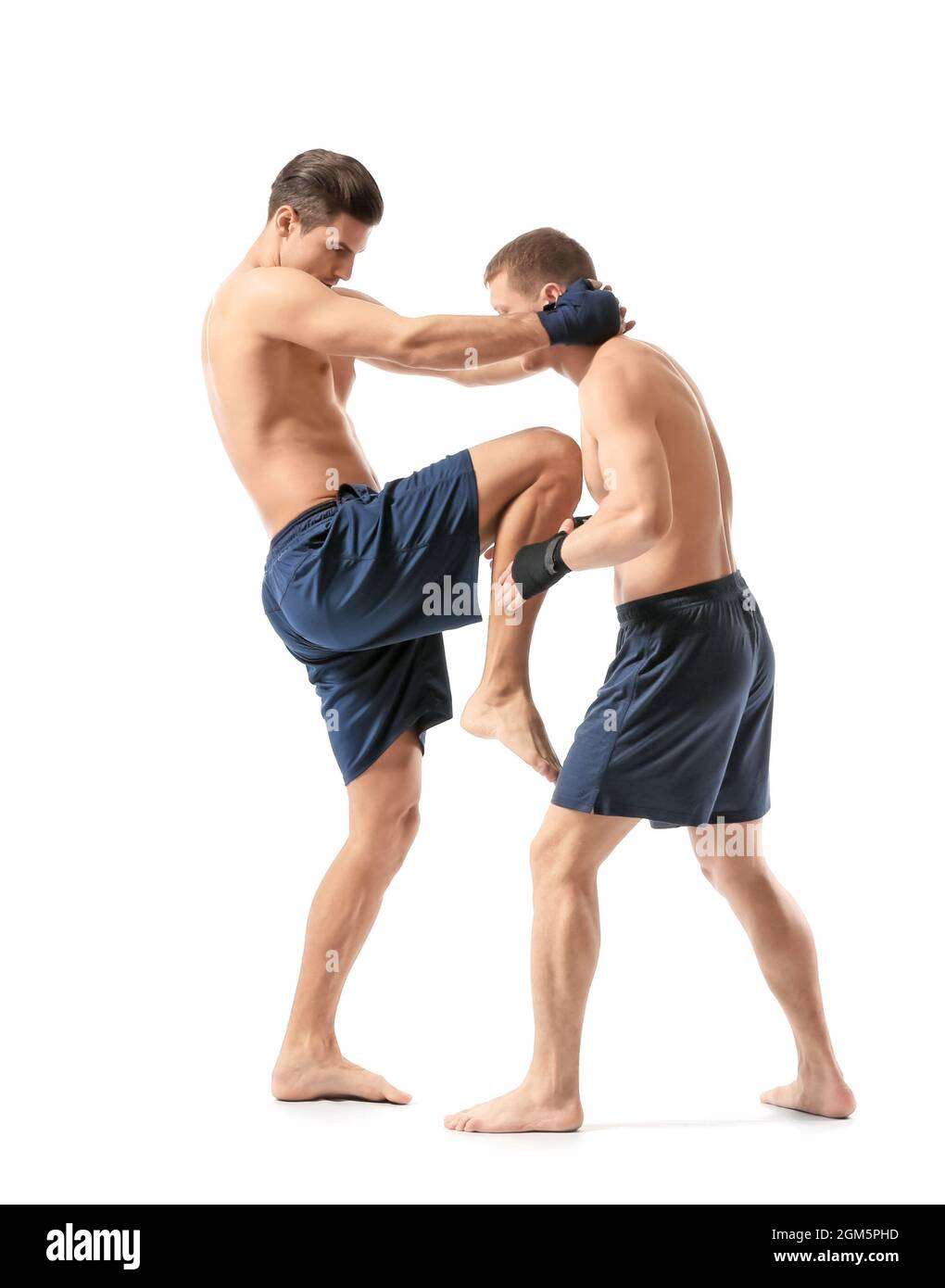 Attractive young kickboxers fighting on white background Stock Photo ...