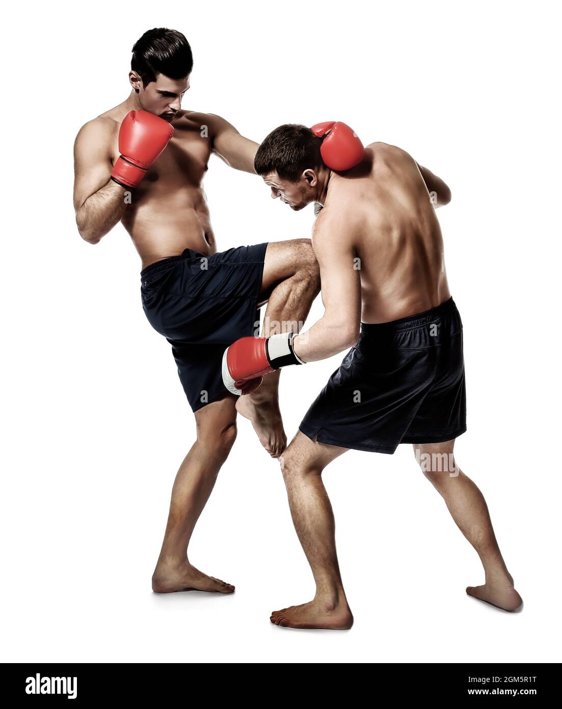 Attractive young kickboxers fighting on white background Stock Photo ...