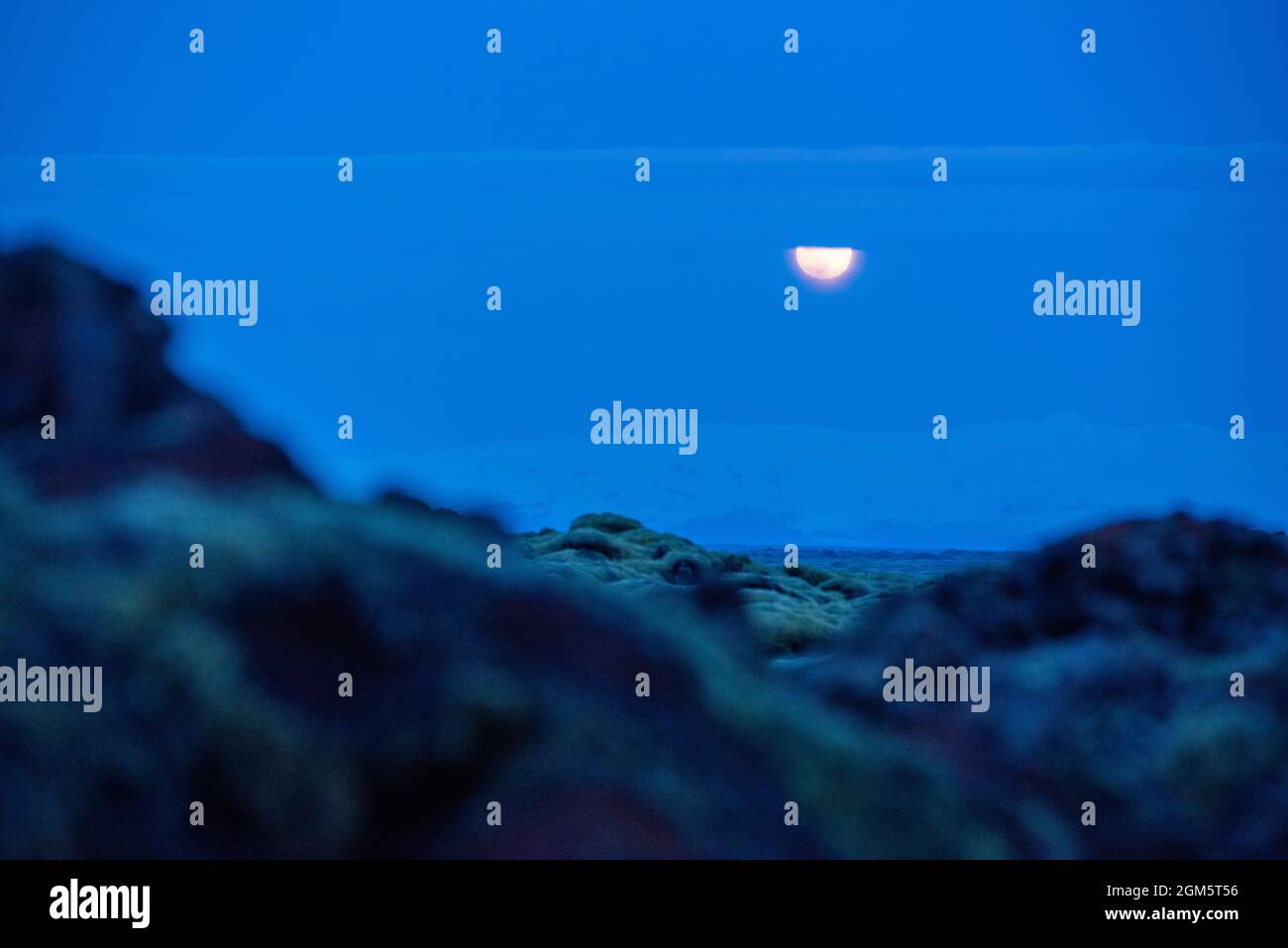 Icelandic landscape photo with moon rising over a glacier Stock Photo ...
