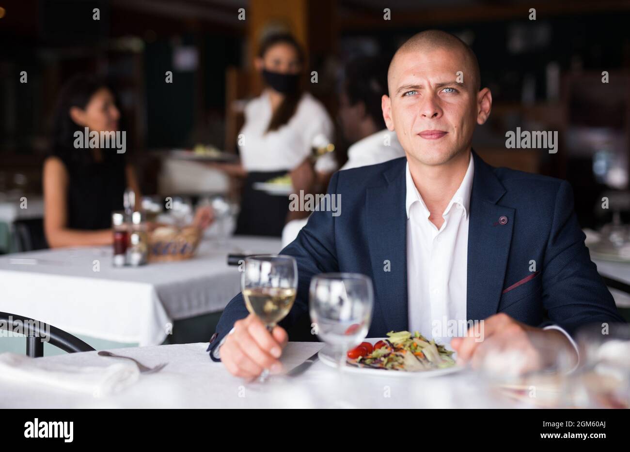 Thoughtful businessman resting and having dinner in restaurant Stock ...