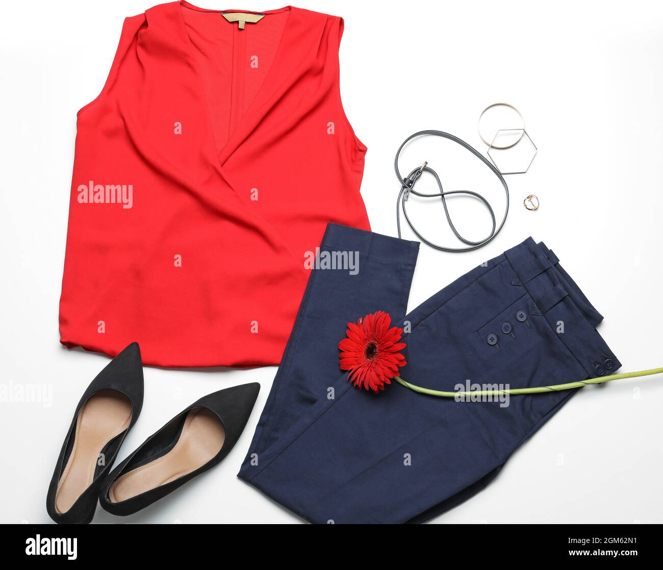 Stylish set of female clothes on white background Stock Photo - Alamy