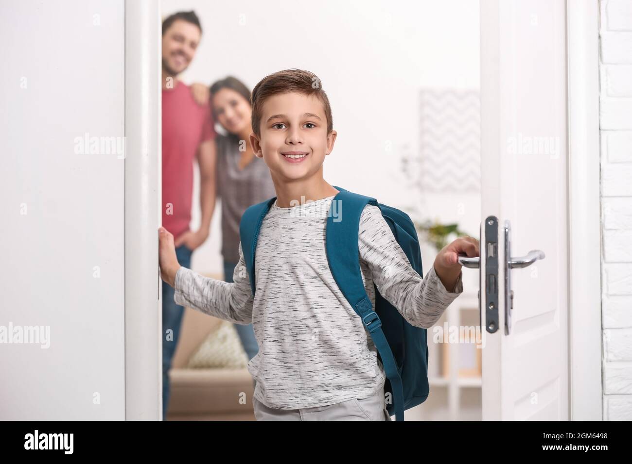 Cute little boy with backpack leaving for school Stock Photo - Alamy
