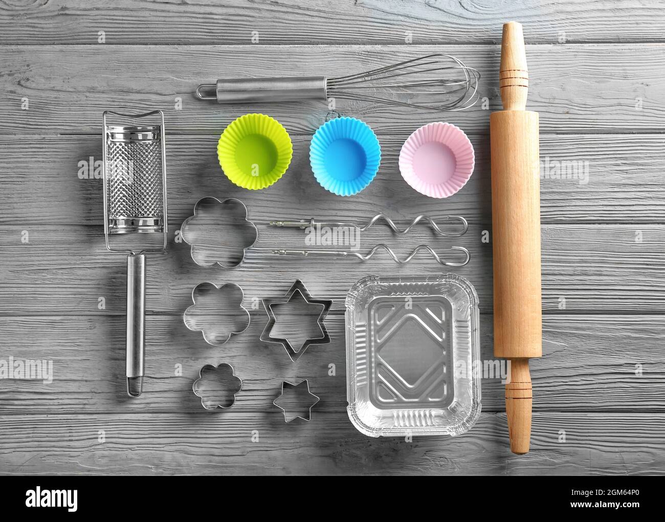 Kitchen utensils for pastries on wooden background Stock Photo - Alamy