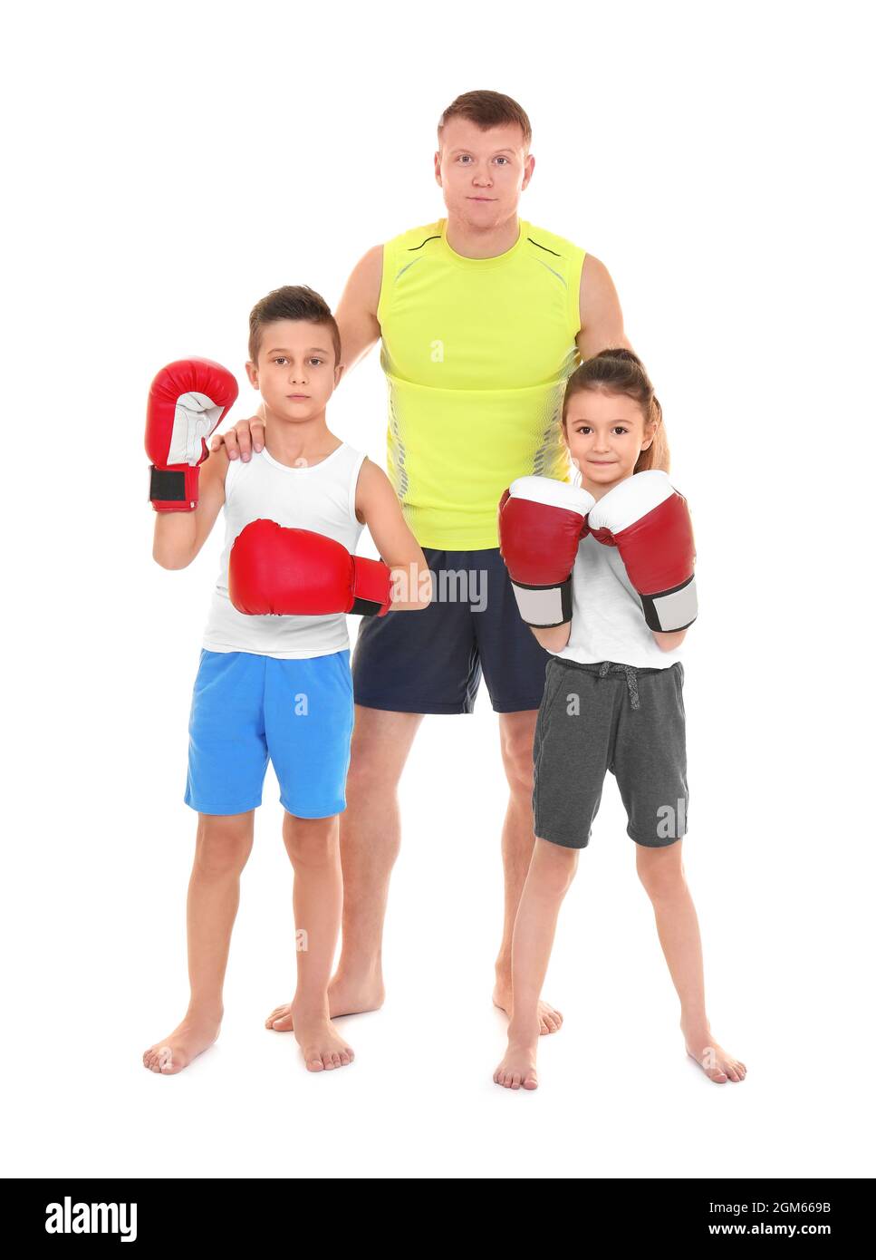 Cute little children with boxing coach on white background Stock Photo ...